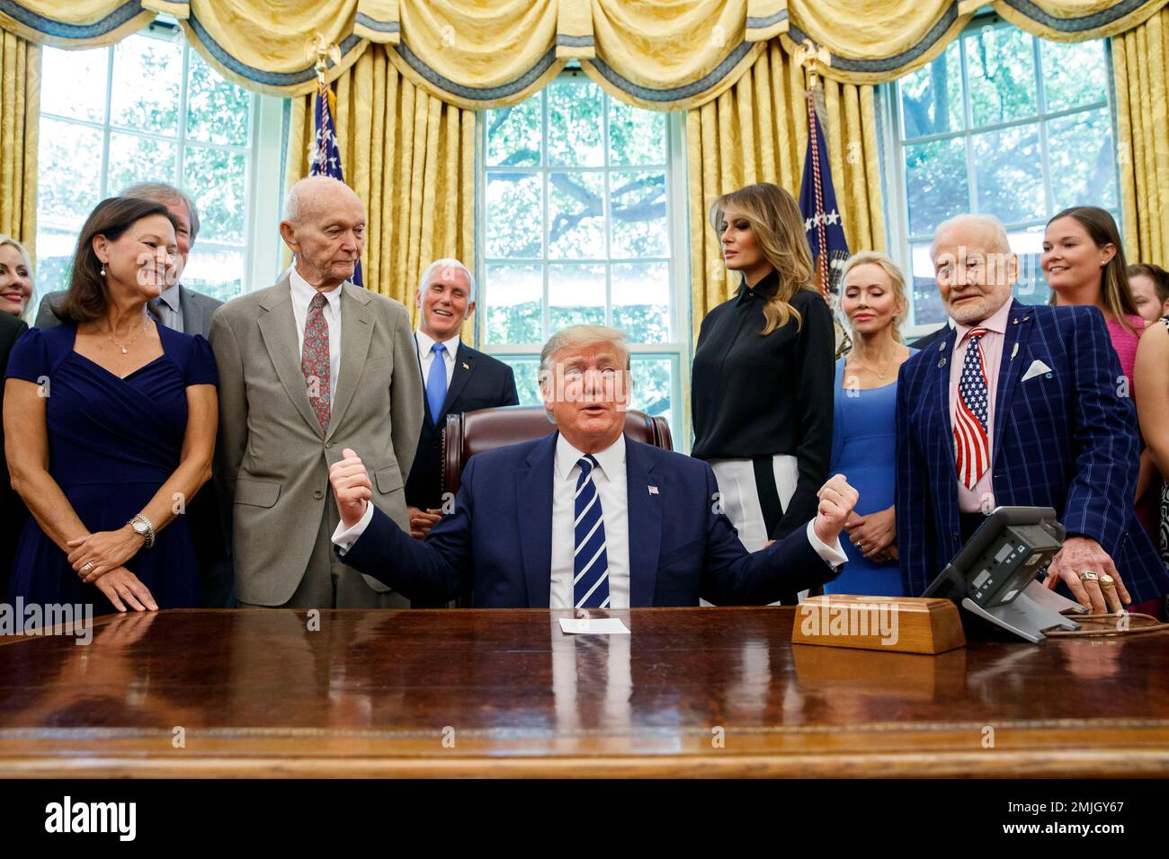 President Donald Trump, accompanied by Apollo 11 astronauts Michael ...