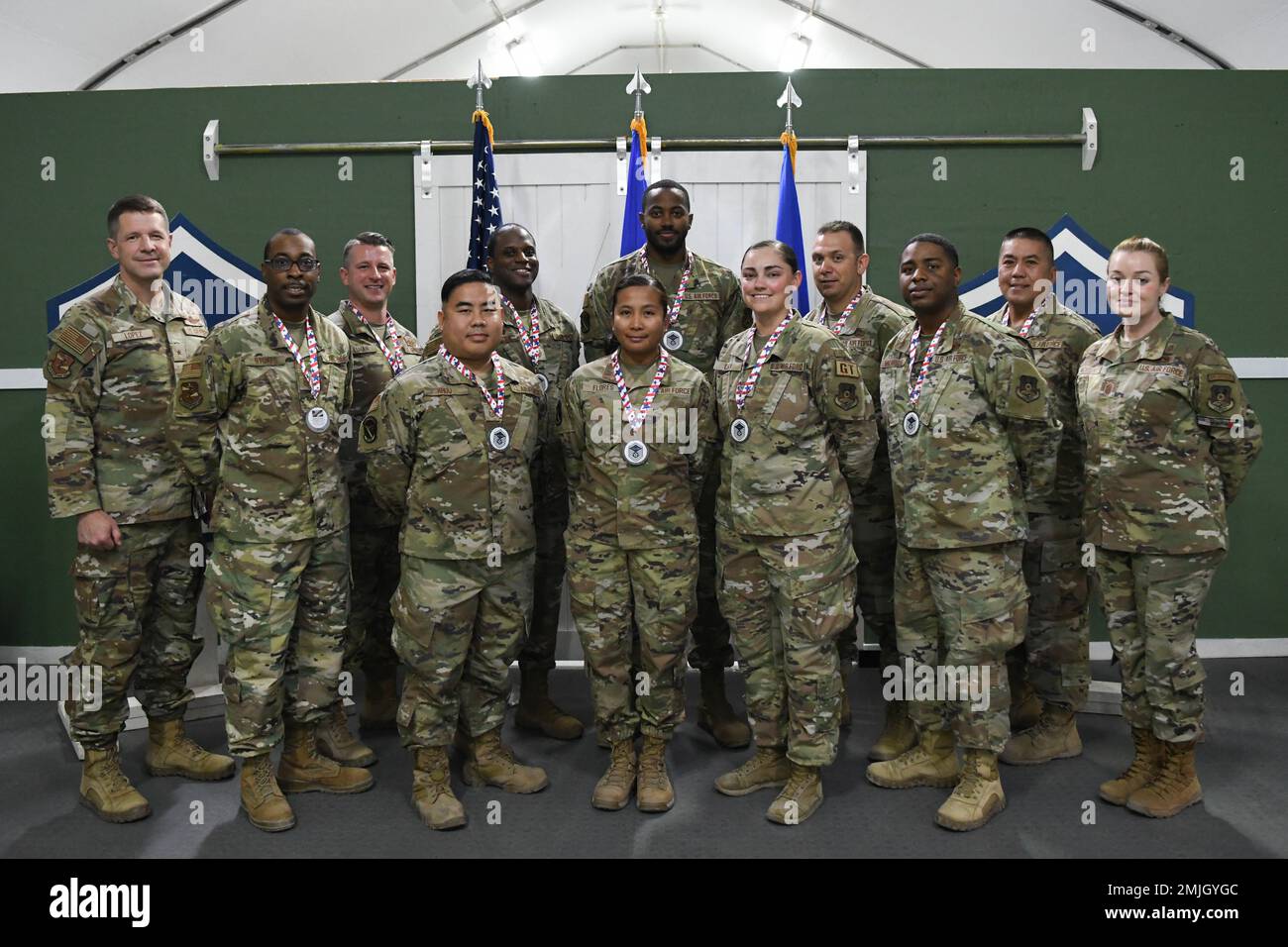 Airmen of the 380th Air Expeditionary Wing pose for a photo with their ...