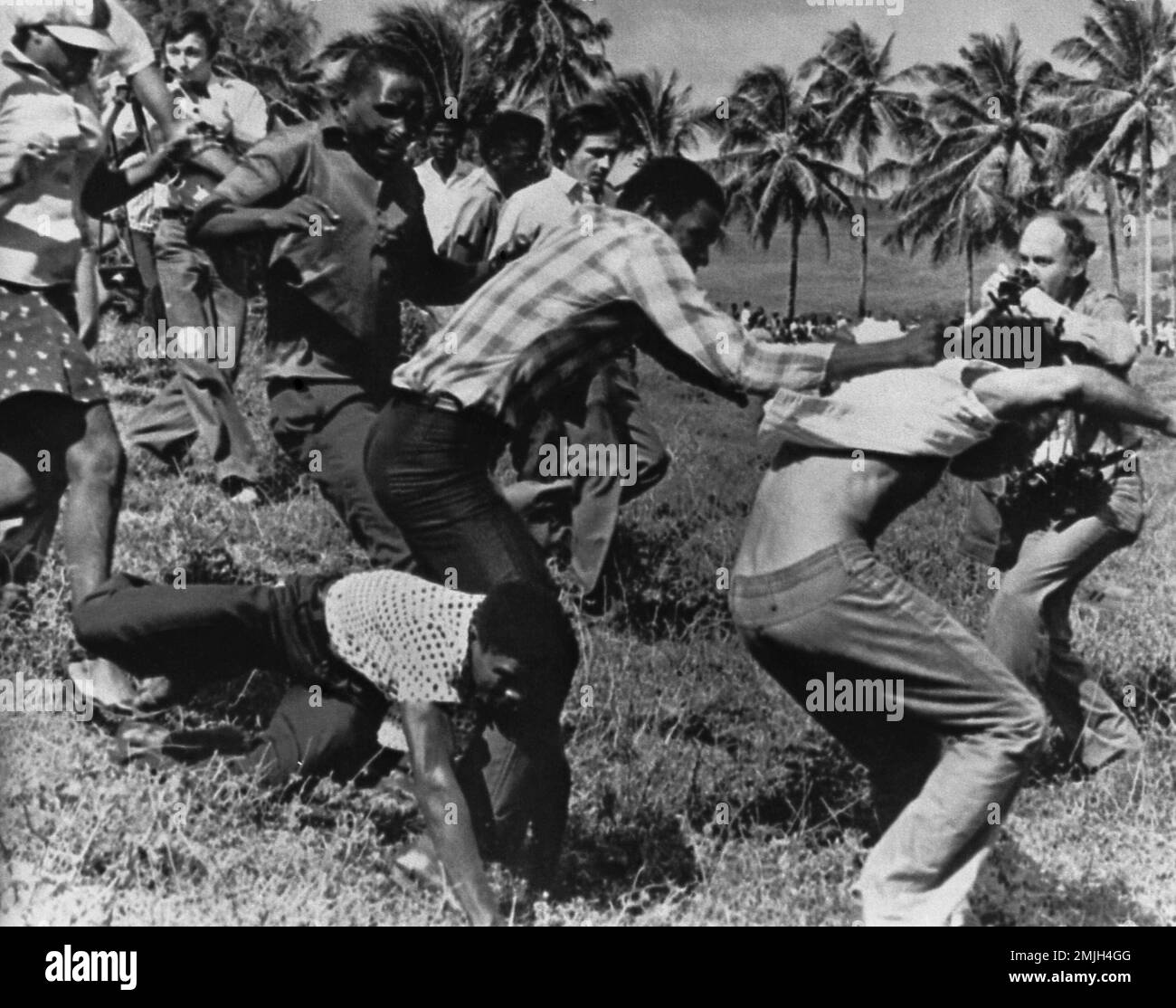 Angry young Giscard supporters fight off a small group of protesters ...
