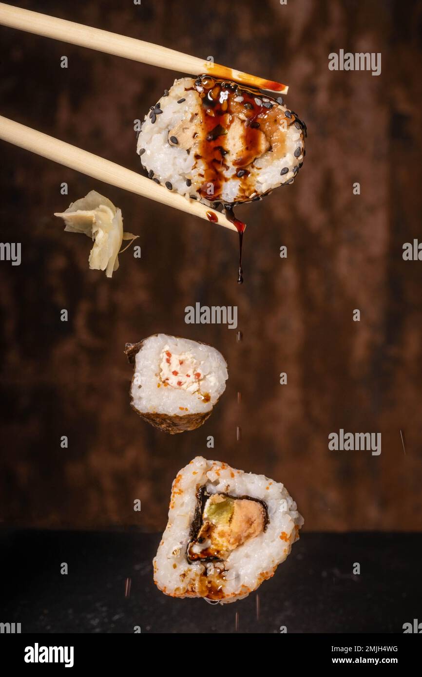 flying sushi with soy sauce and chopsticks Stock Photo - Alamy