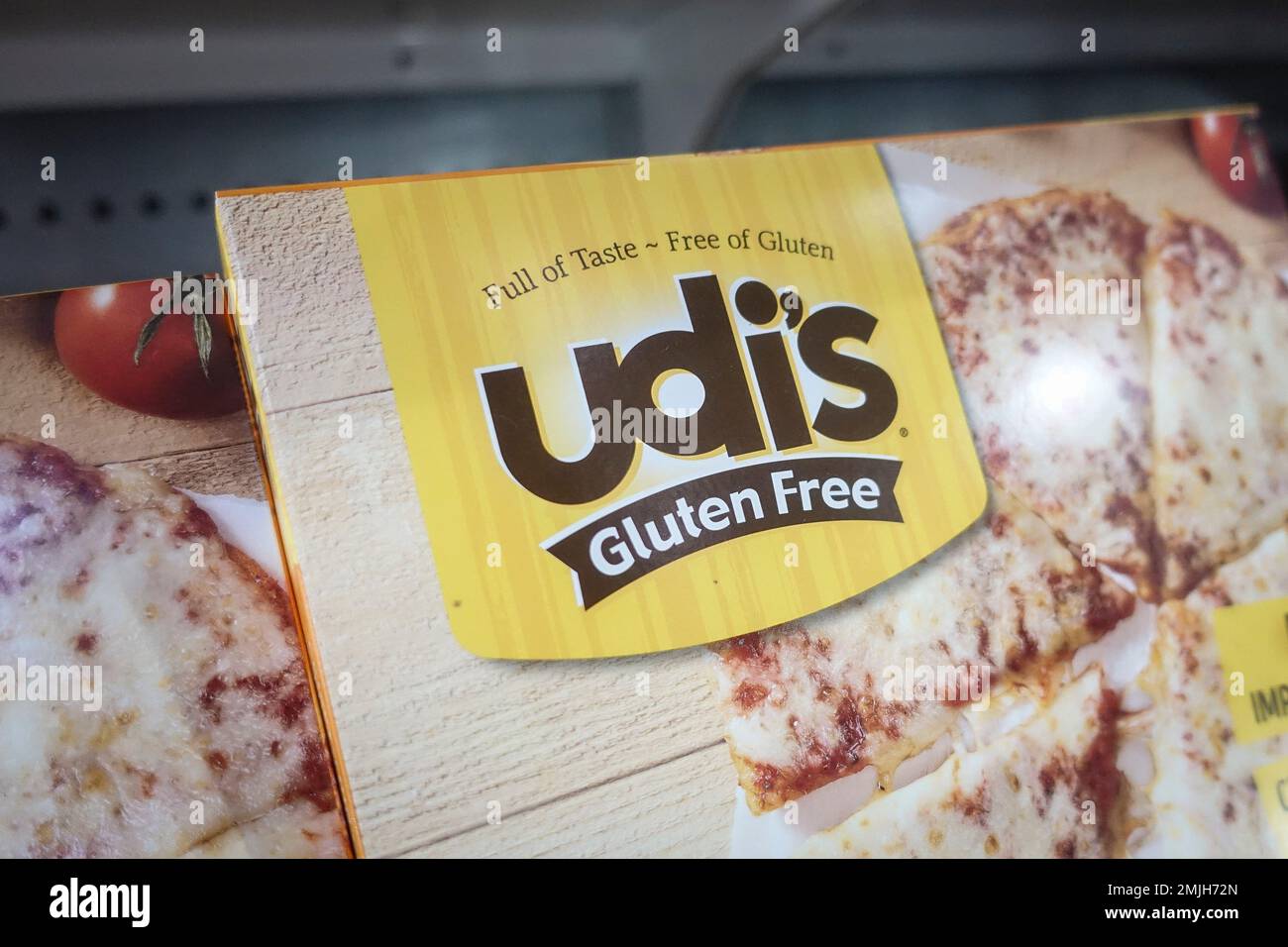 Frozen pizzas by udi's, a Conagra brand, rest on a supermarket shelf ...