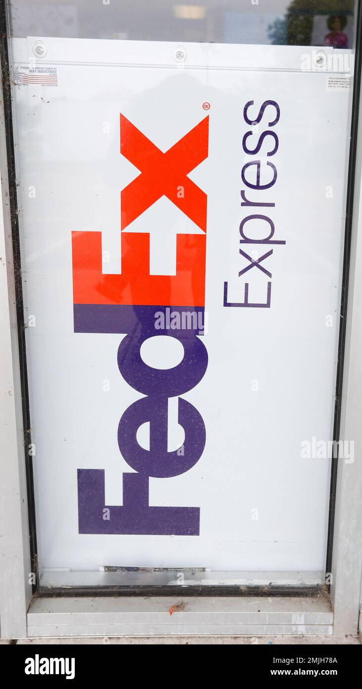 A FedEx drop-off box sits inside one of their multi service Print and ...