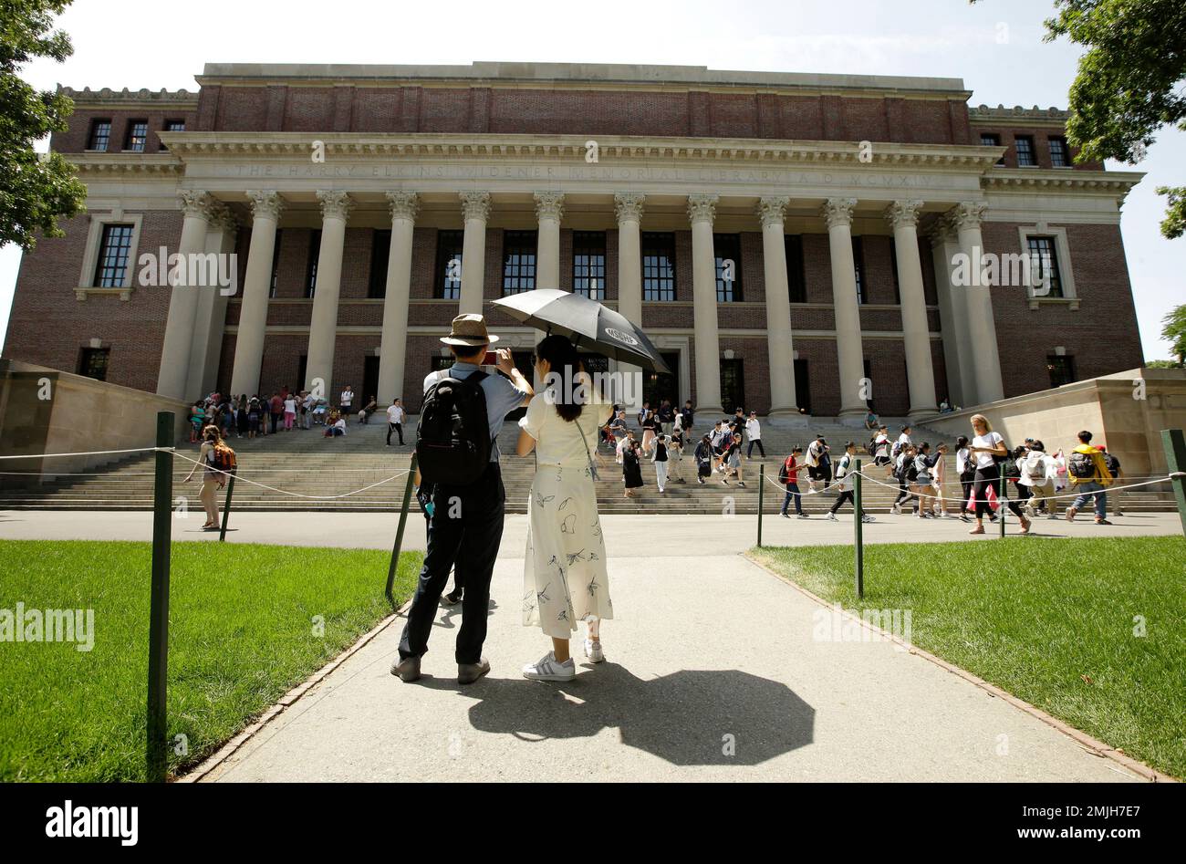 In this Tuesday, July 16, 2019 photo people stop to record images of ...