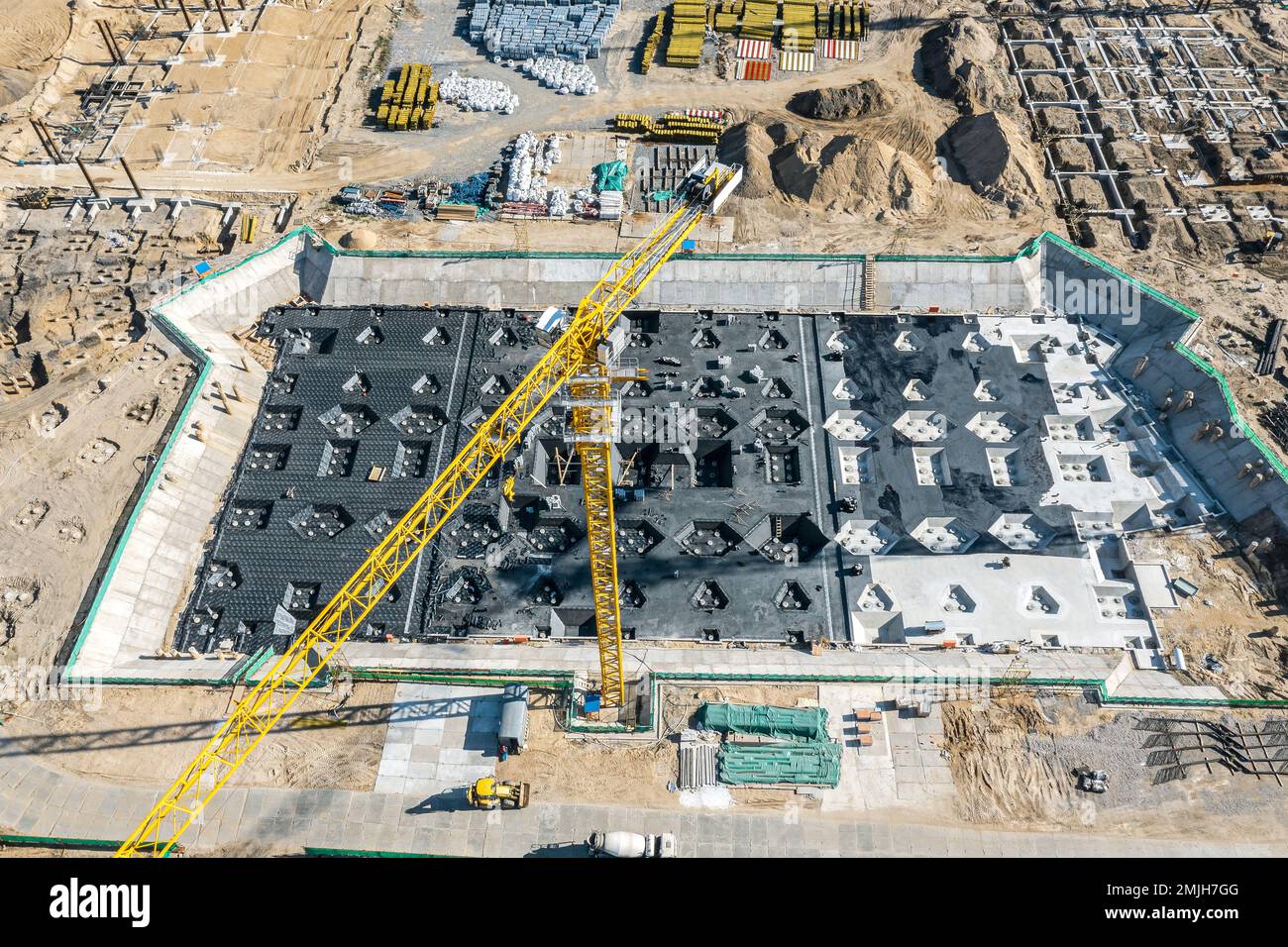 slab-on-grade foundation on construction site. busy construction site ...