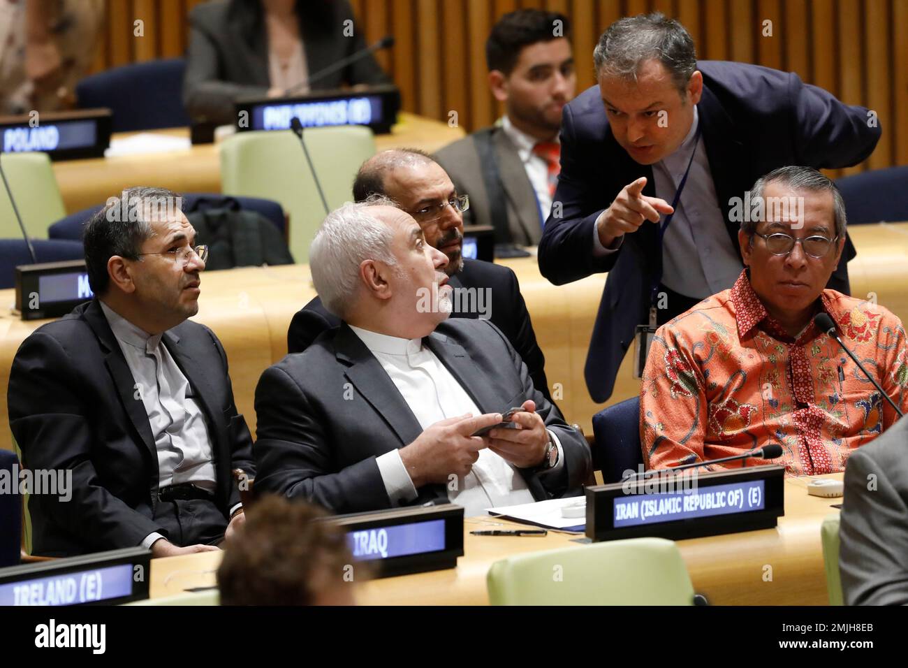 Iran's Foreign Minister Javad Zarif, second left, confers before his address to the High Level ...