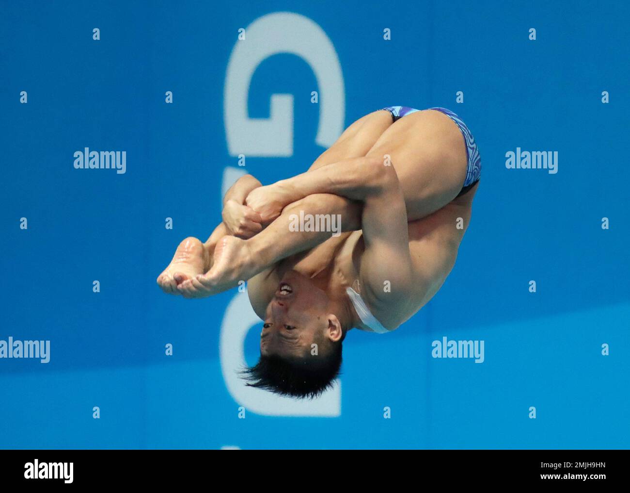 Japan's Ken Terauchi competes during the men's 3m springboard diving ...