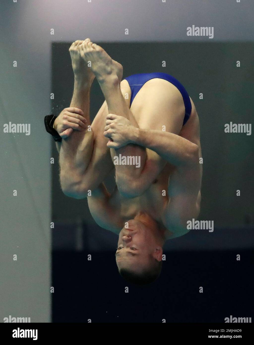 Russia's Evgenii Kuznetsov competes during the men's 3m springboard ...