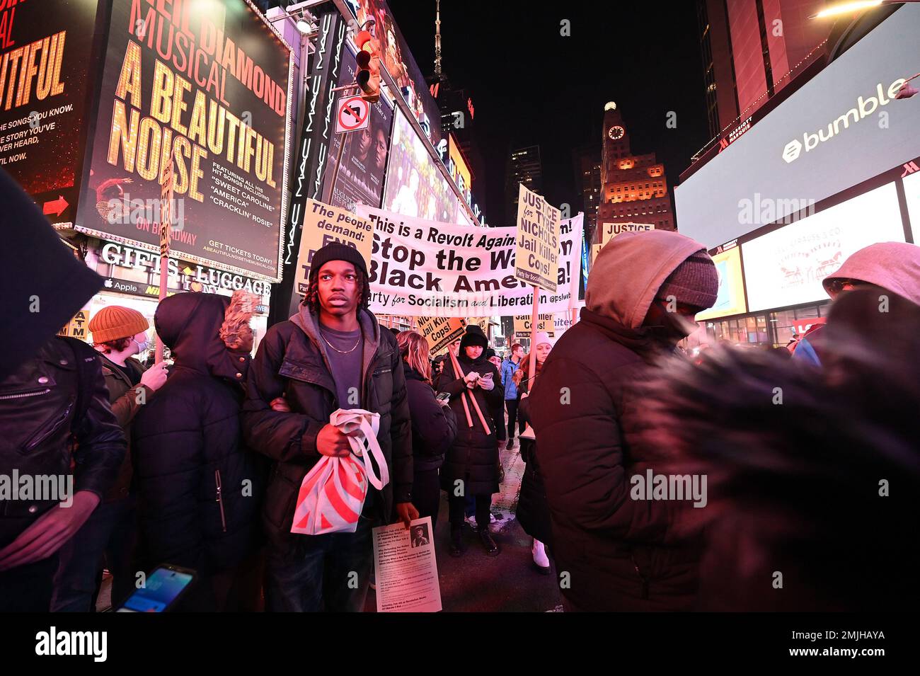 New York, USA. 27th Jan, 2023. Demonstrators hold signs as they march ...