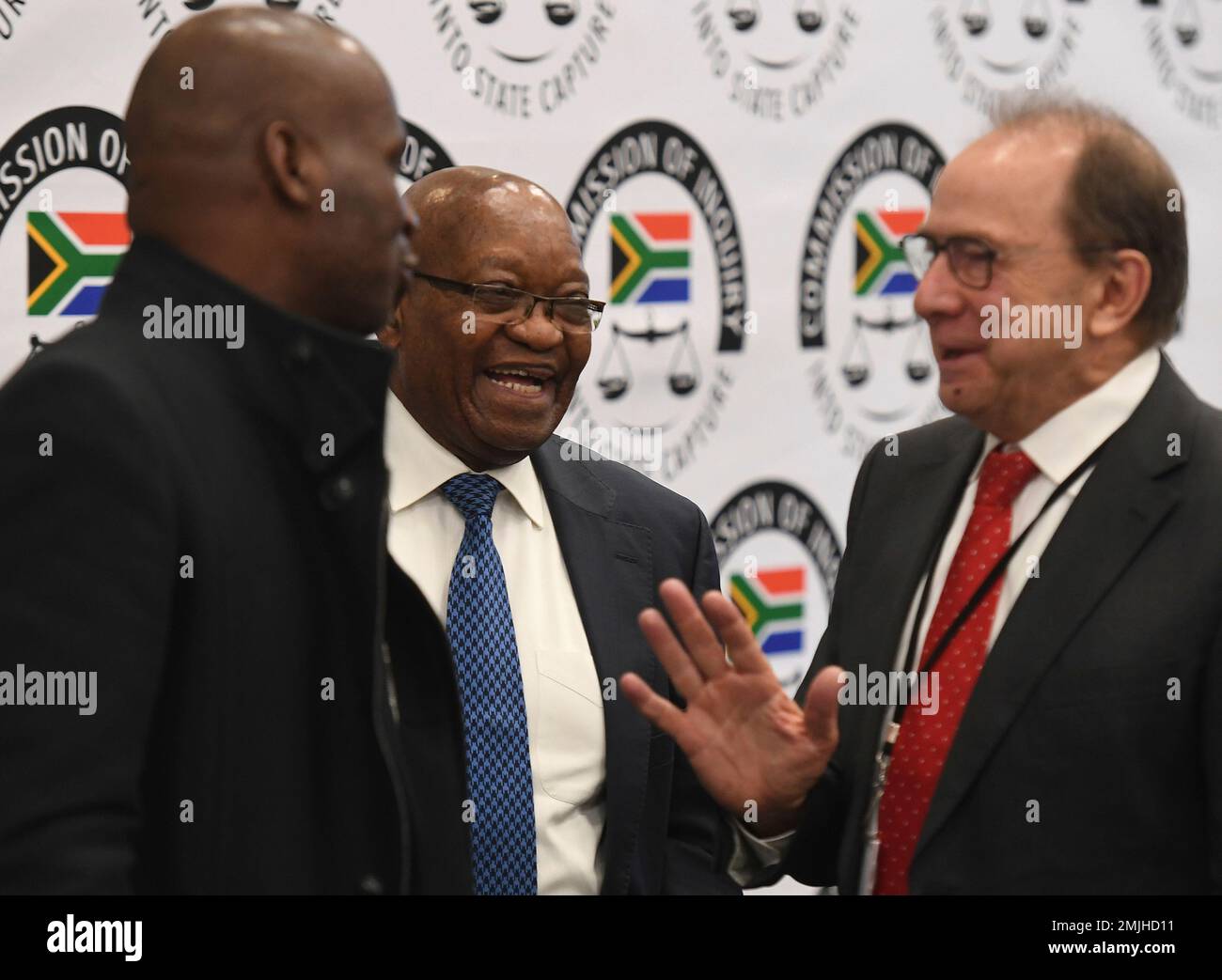 Former South African president Jacob Zuma, centre, flanked by his legal ...