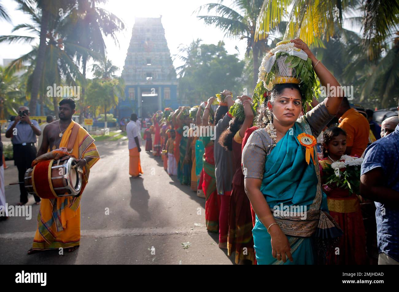 Sri Lankan Hindu devotees participate in a Paal Kudam, a ritual where ...