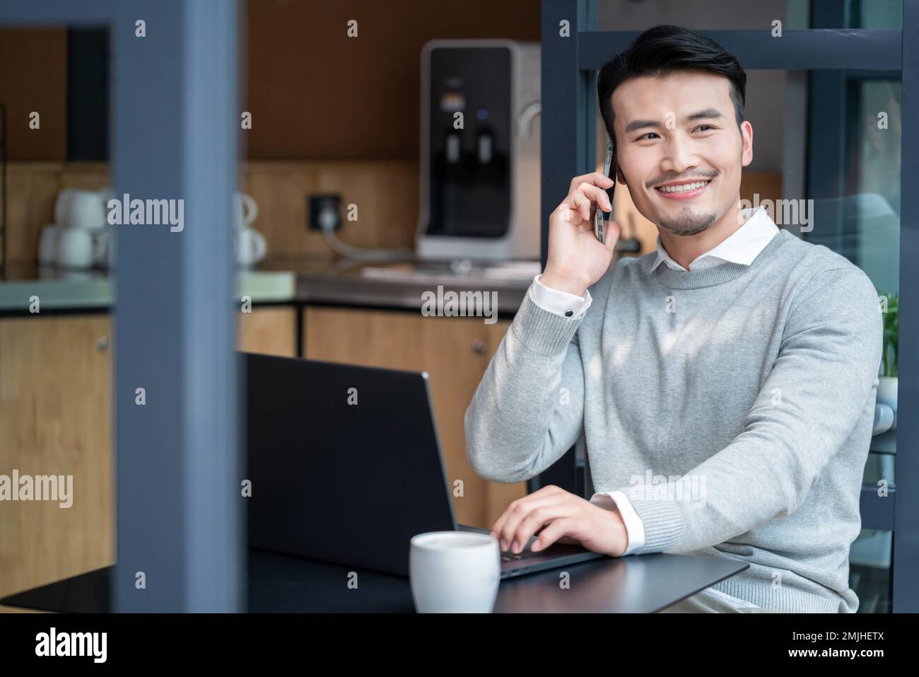 Young men who use a computer Stock Photo - Alamy