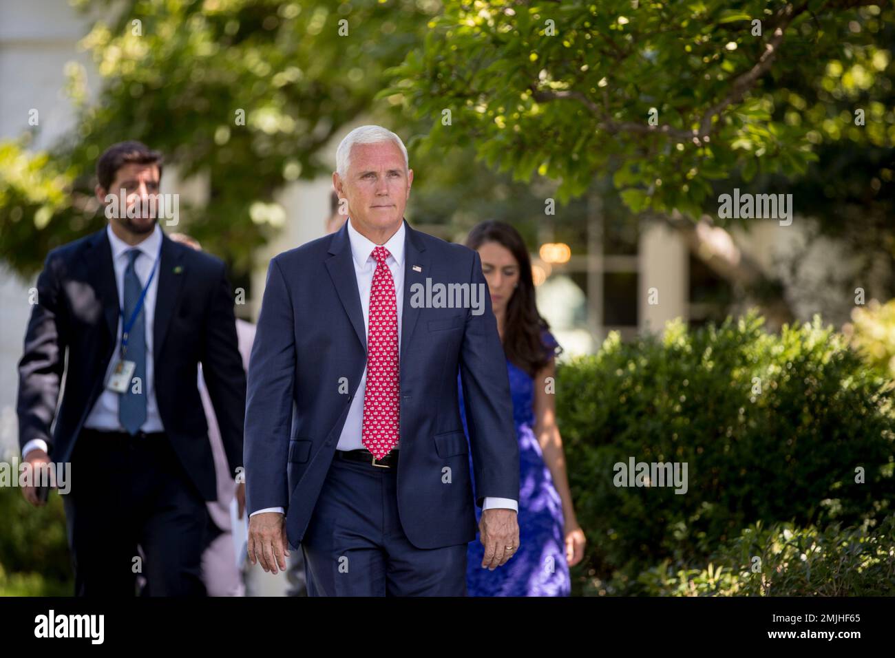 Vice President Mike Pence walks out to the South Lawn as he tours the ...