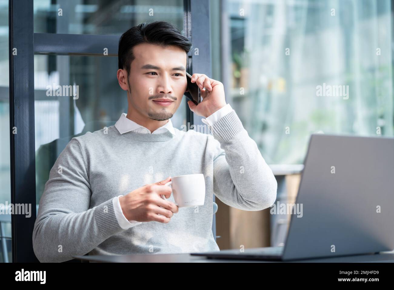 Young men who use a computer Stock Photo - Alamy