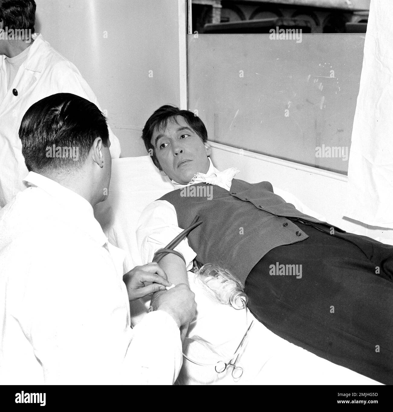 British actor Christopher Lee donates his blood in a Bloodmobile of the ...