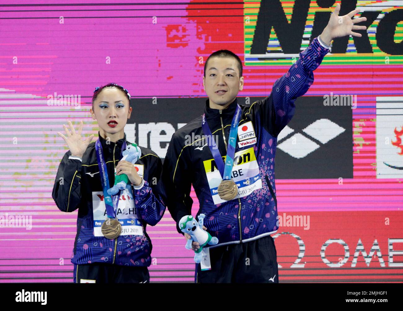 CORRECTS SPELLING OF ATSUSHI Japan's Atsushi Abe, right, and Yumi ...