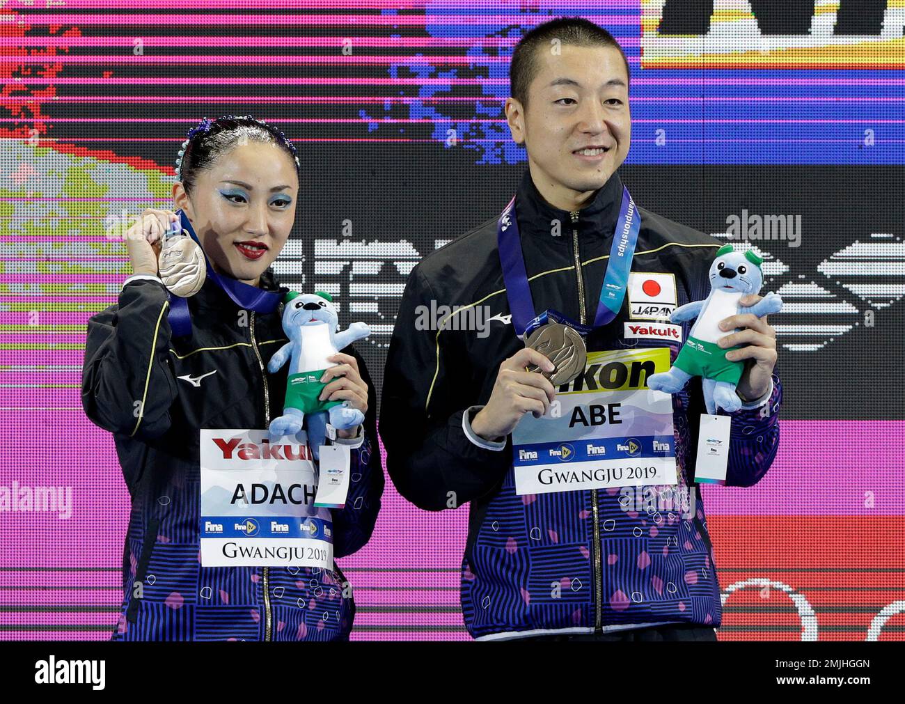 CORRECTS SPELLING OF ATSUSHI Japan's Atsushi Abe, right, and Yumi ...