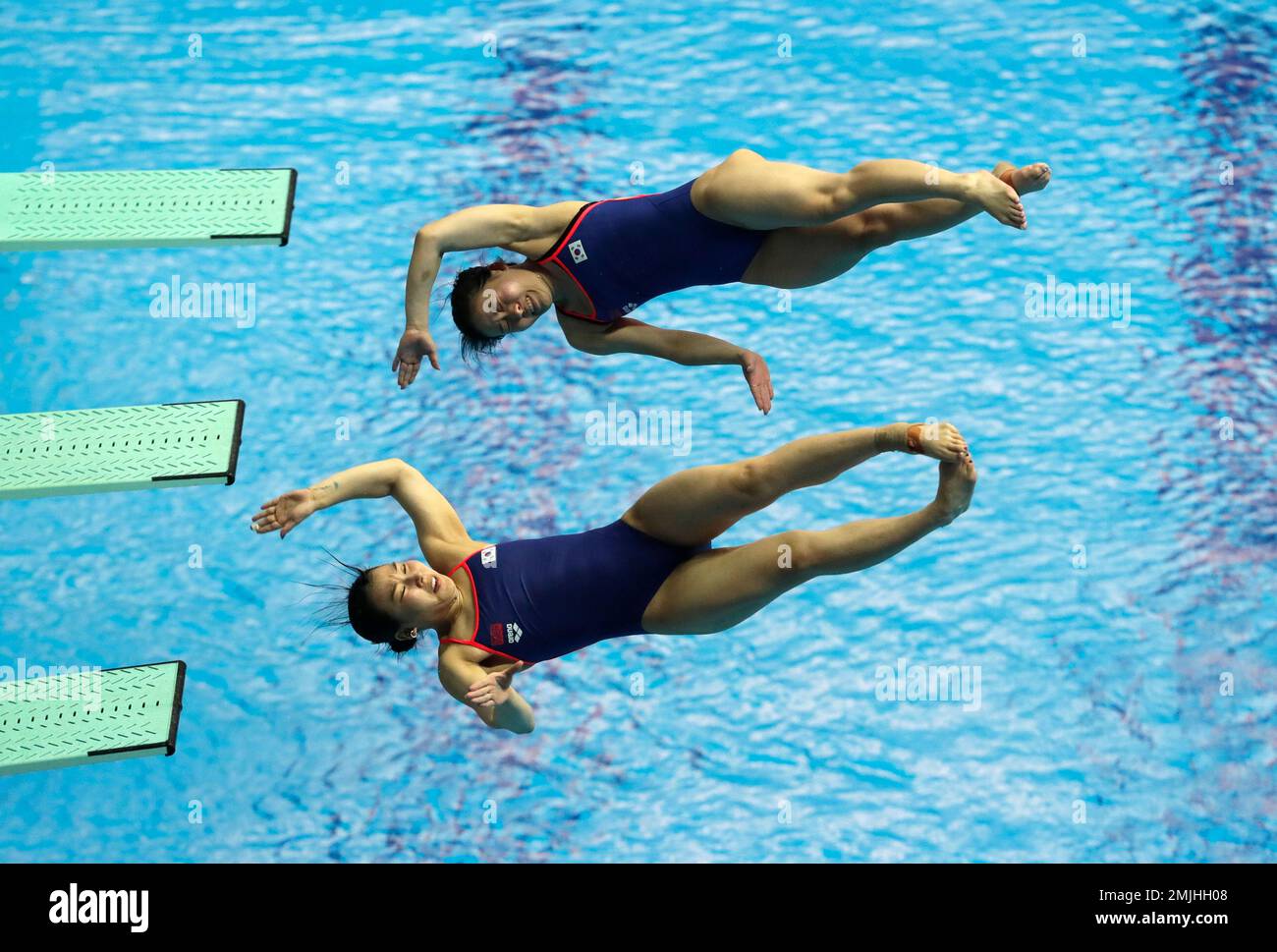 Cho Eunbi and Kim Suji of South Korea compete during the women's 3m ...