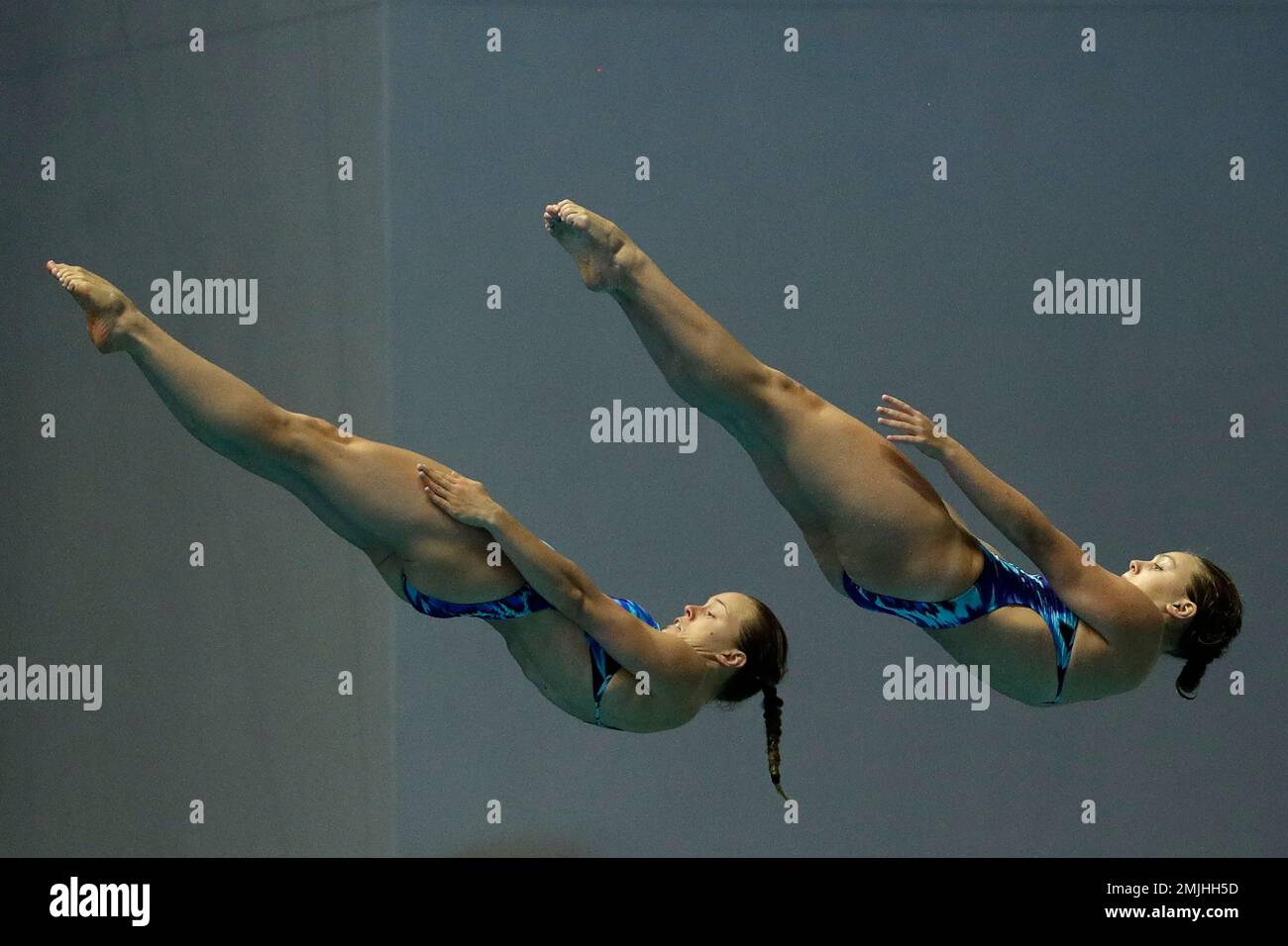 Alison Gibson and Krysta Palmer of the United States compete in the ...