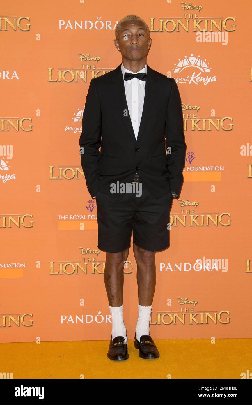 Singer Pharrell Williams poses for photographers upon arrival at the ...