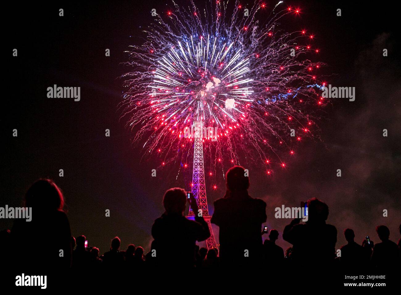 Fireworks illuminate the Eiffel Tower in Paris during Bastille Day ...