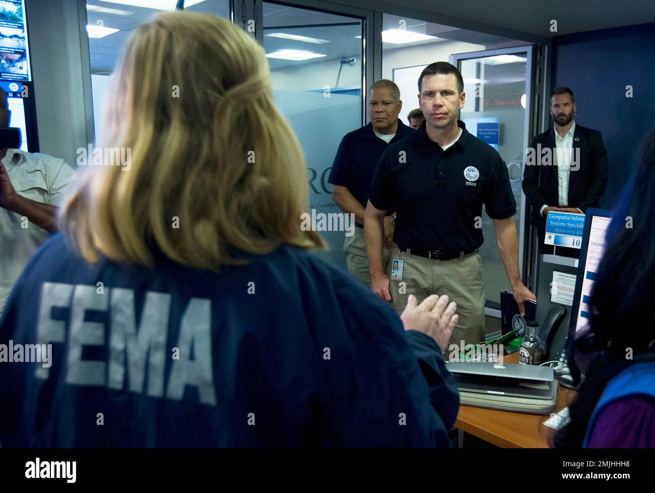 Acting Homeland Security Secretary Kevin McAleenan, center, speaks with ...