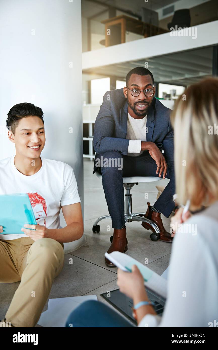 Combining their creative input. a group of colleagues having a ...