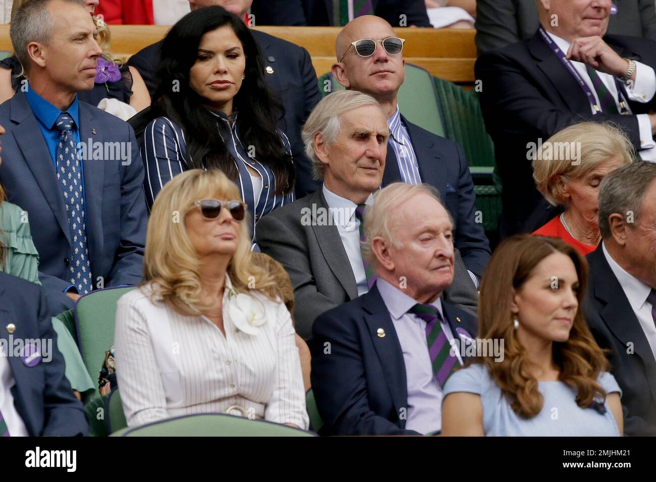 Amazon founder Jeff Bezos, top and third from left, and Lauren Sanchez ...