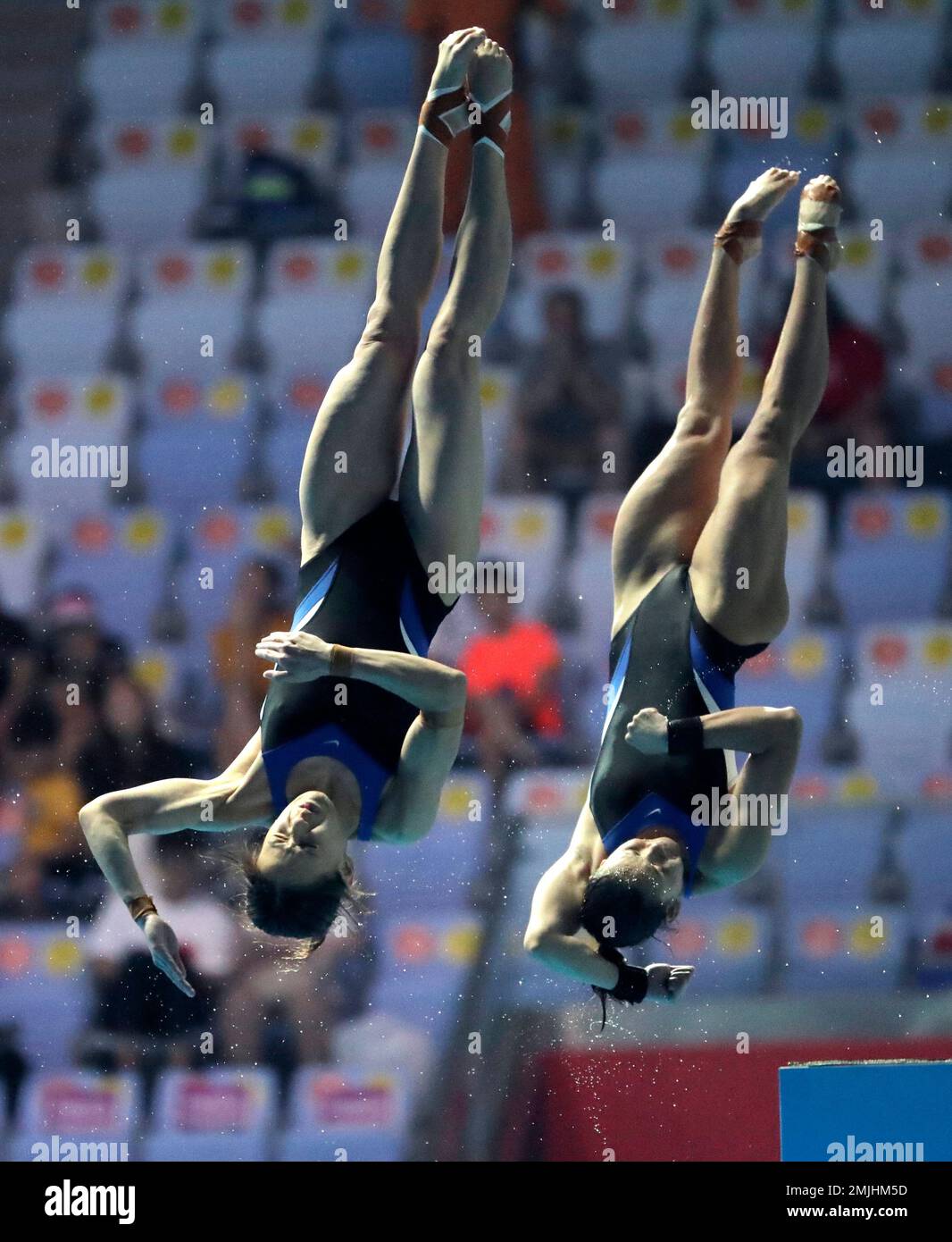 Malaysia's Leong Mun Yee and Pandelela Pamg compete in the 10m platform ...