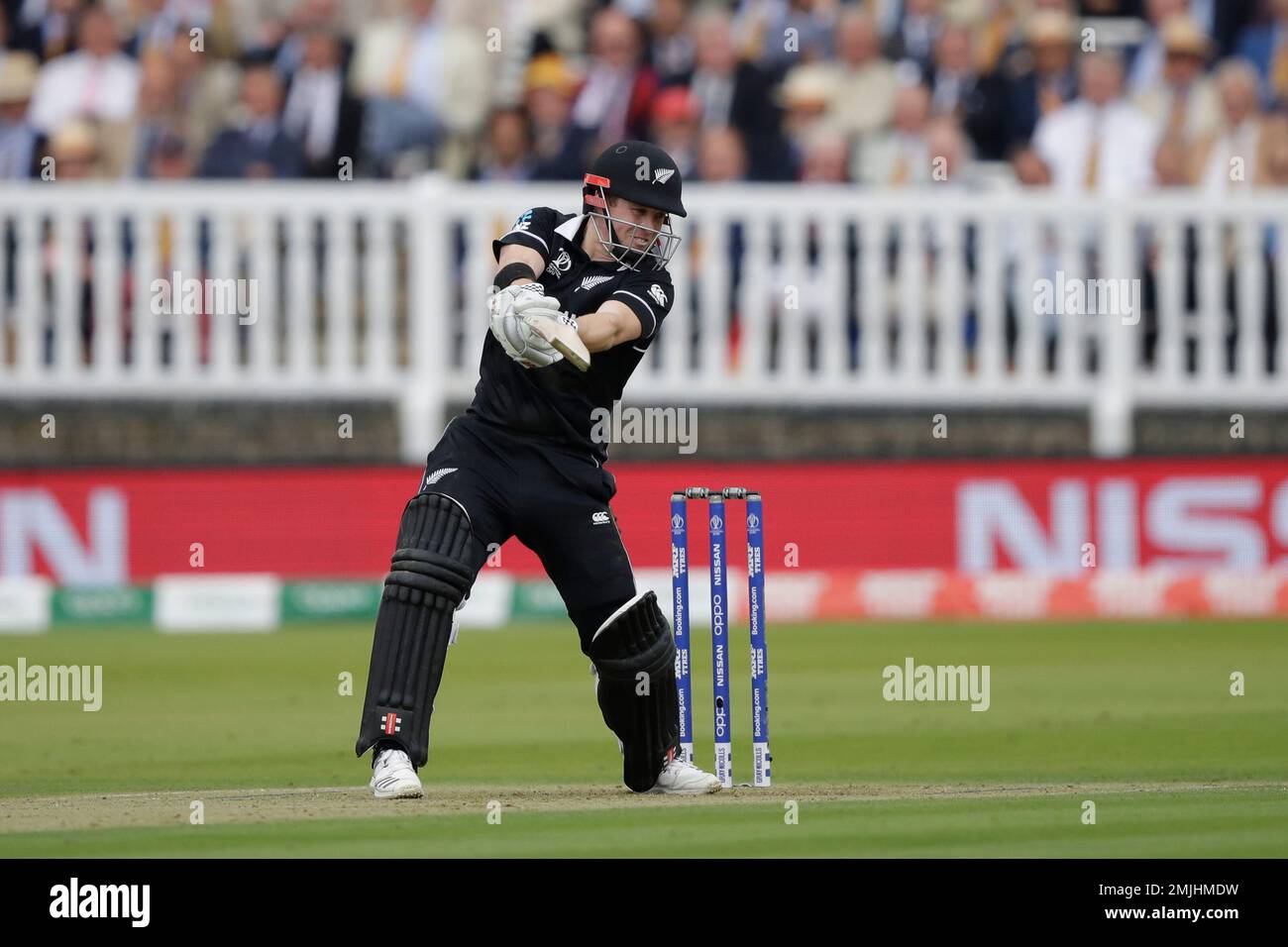 New Zealand's Henry Nicholls hits a four during the Cricket World Cup ...