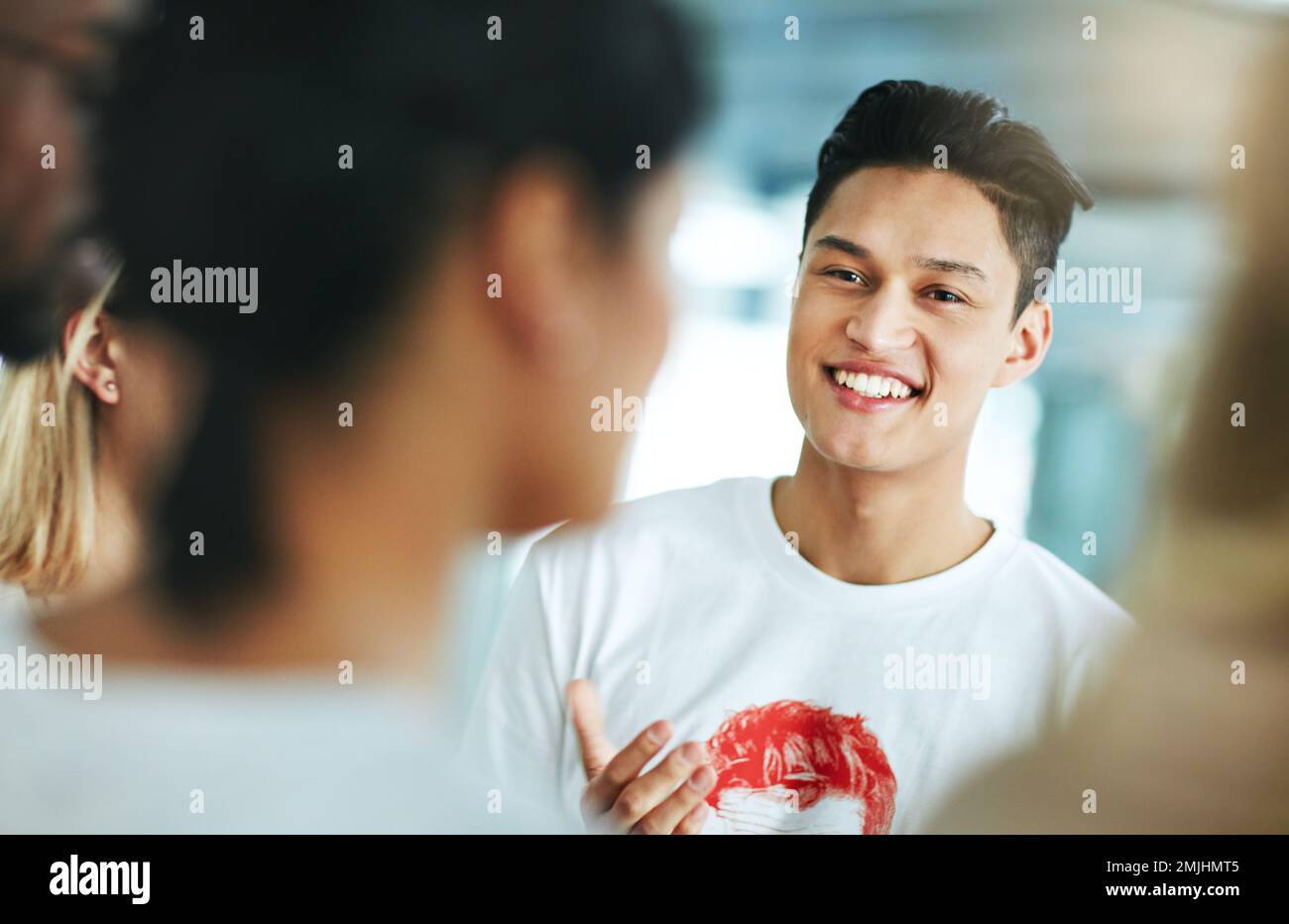 The colleague everyone gets along with. a group of colleagues having a ...