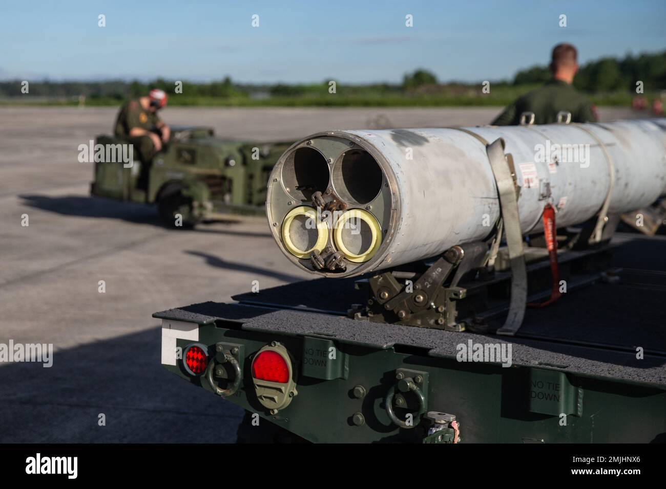 U.S. Marines with Marine Attack Squadron (VMA) 223 load ordnance onto ...