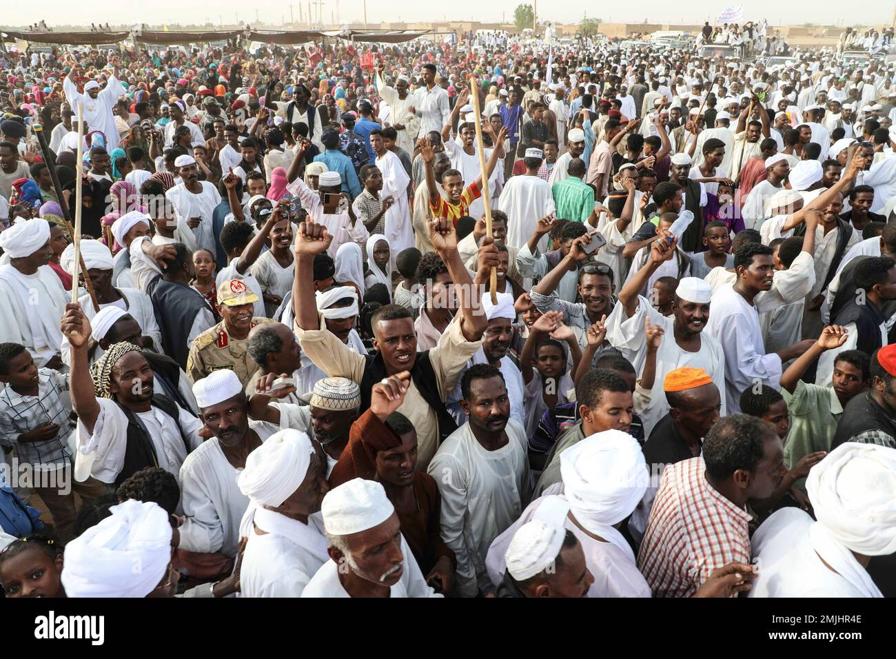 A crowd gathers as Gen. Mohammed Hamdan Dagalo, the deputy head of the ...