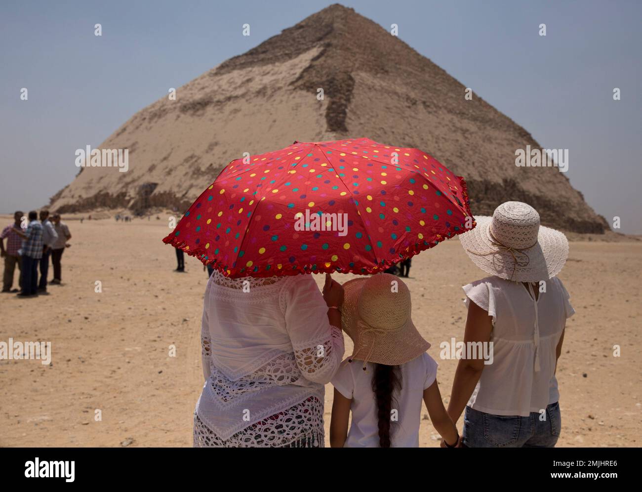Women visit the Bent Pyramid during an during an event opening the ...