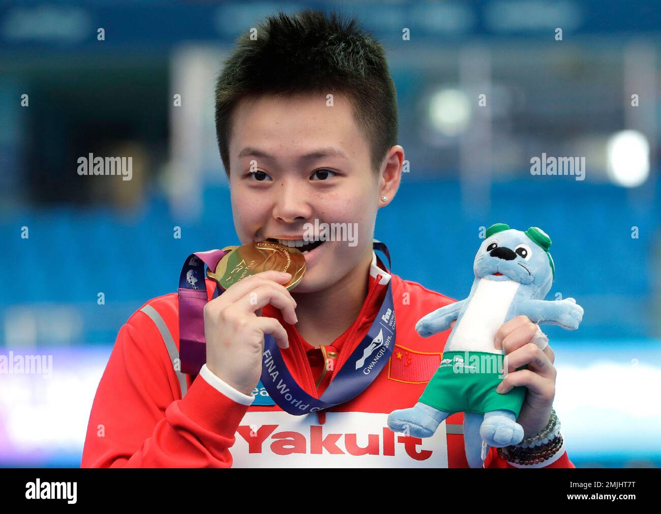 Chen Yiwen of China holds her gold medal after competing in the women's ...