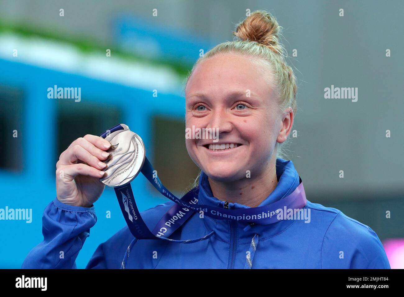 Sarah Bacon of the United States holds her silver medal after competing ...