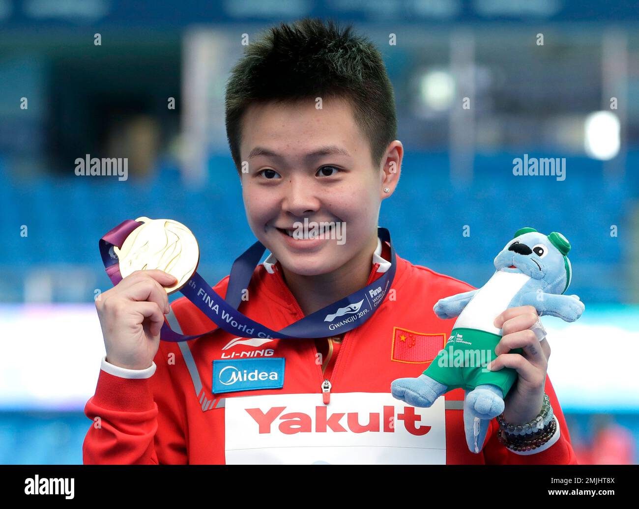 Chen Yiwen of China holds her gold medal after competing in the women's ...