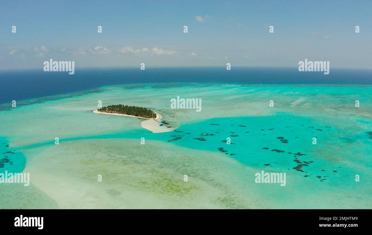 Tropical island with beautiful beach, palm trees and turquoise water ...