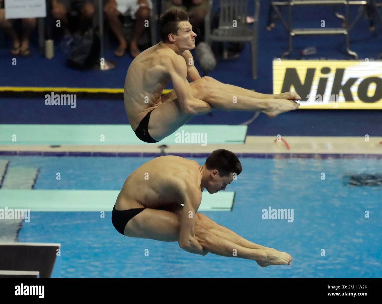 Germany's Lars Rudiger and Patrick Hausding compete during the men's 3m ...