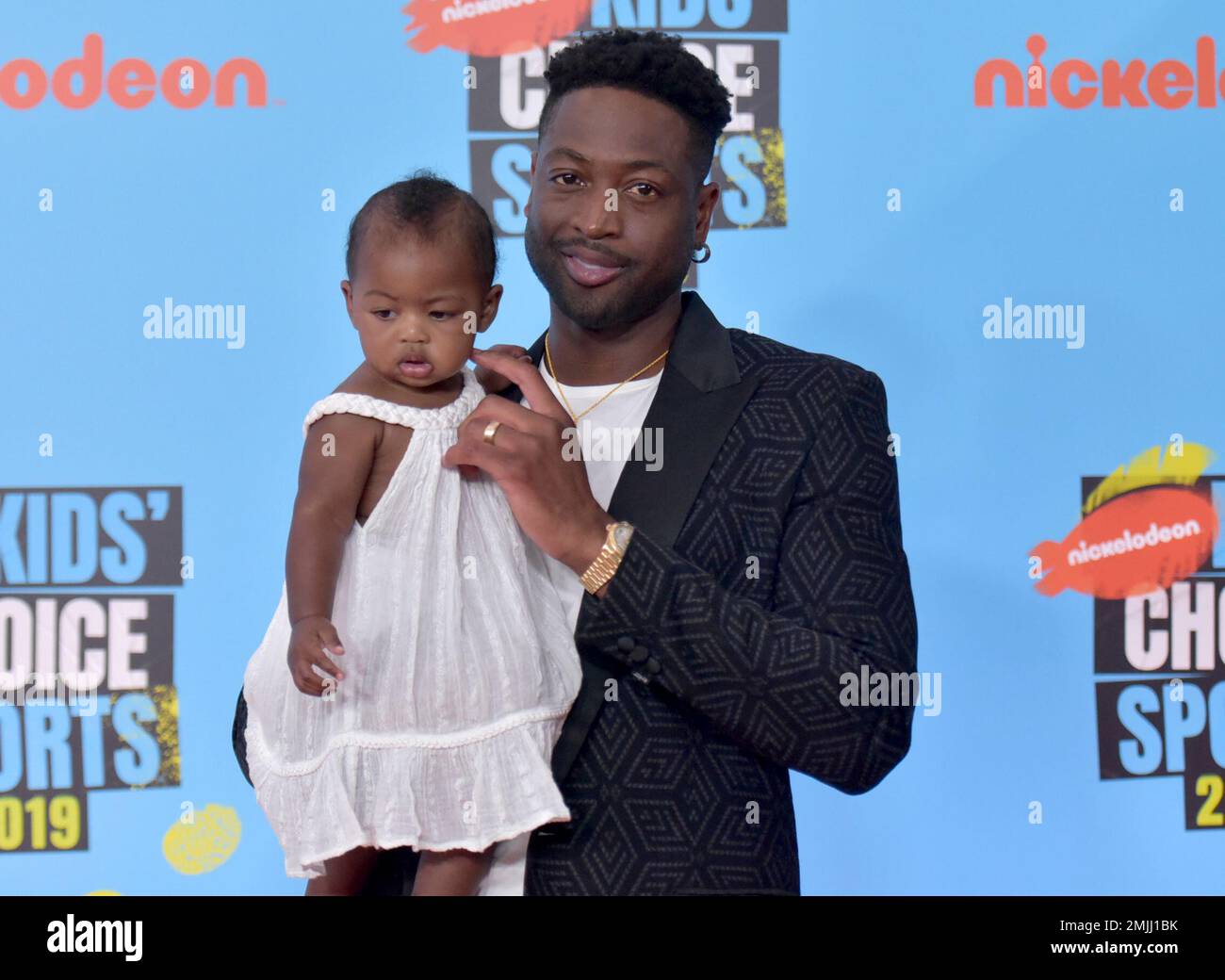 Dwyane Wade, right, and his daughter Kaavia James Union Wade arrive at ...