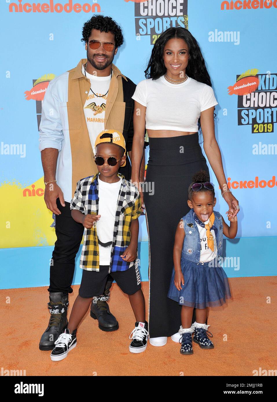 NFL player Russell Wilson, of the Seattle Seahawks, back row left ...