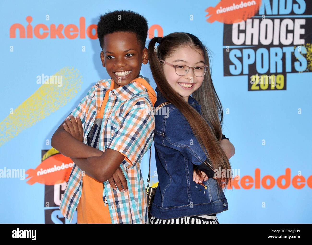Jamir Vega, left, and Saya Watkins arrive at the Kids' Choice Sports ...