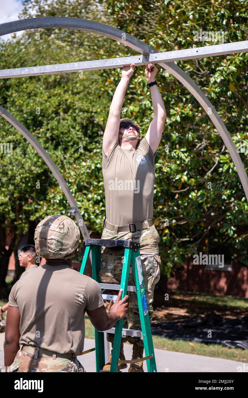 U.S. Army Spc. Nathan Priest, with support from Army Spc. Cedric Willis ...