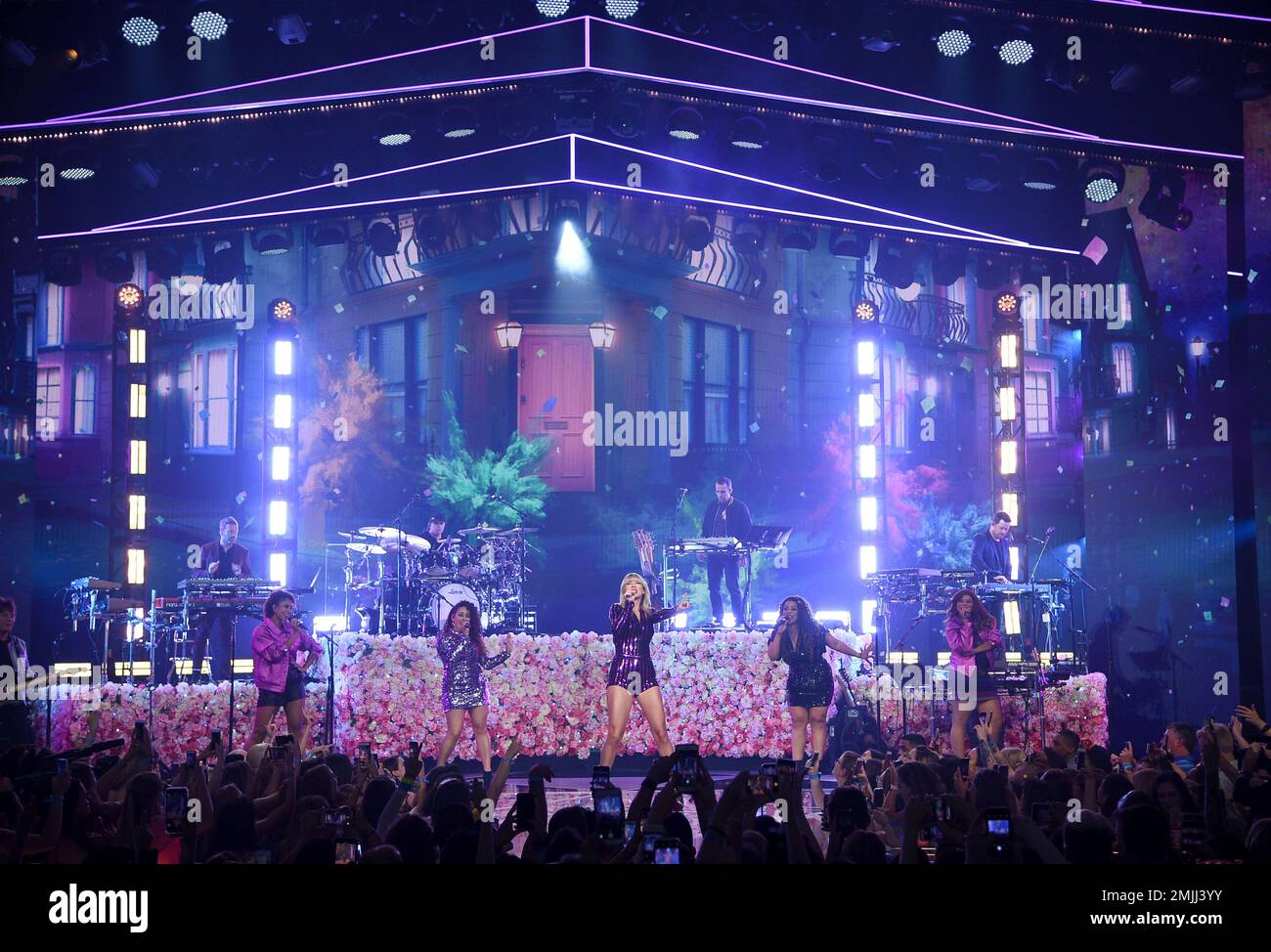 Singer Taylor Swift, center, performs at Amazon Music's Prime Day ...