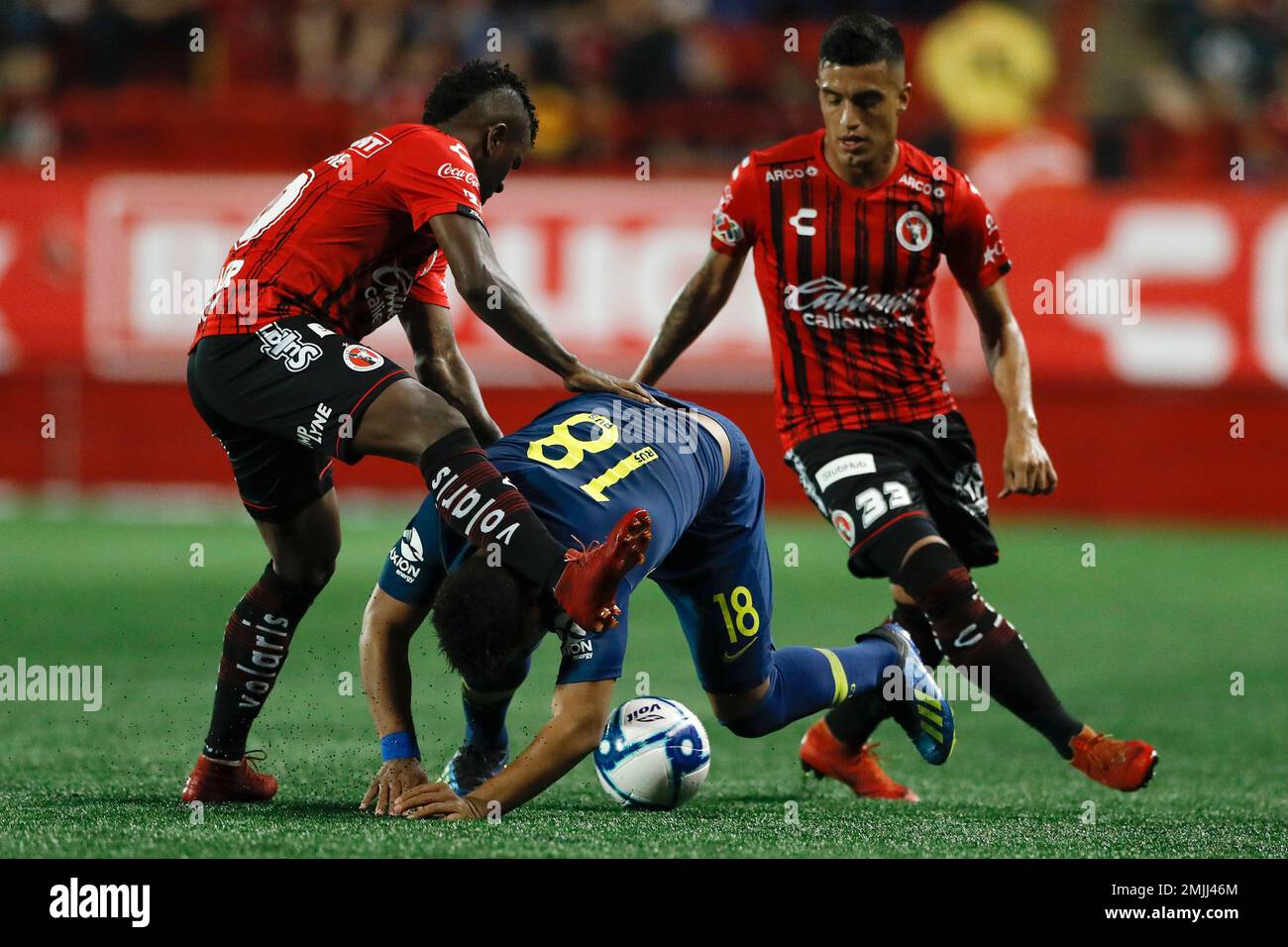 Tijuana's Miller Bolanos, left, collides with Boca Juniors's Frank ...