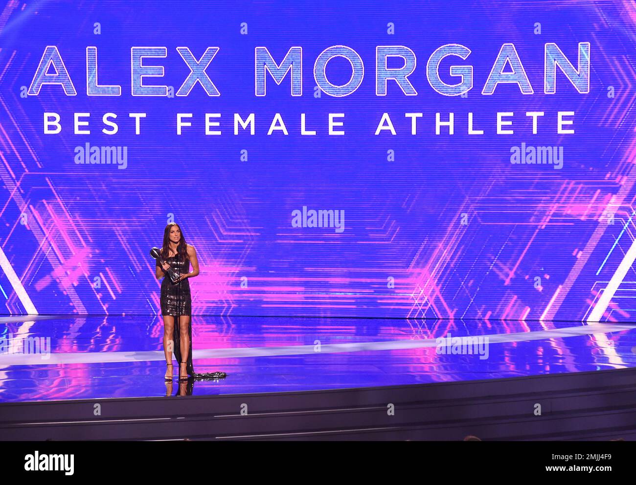 Alex Morgan, a member of the U.S Women's national soccer team, accepts ...