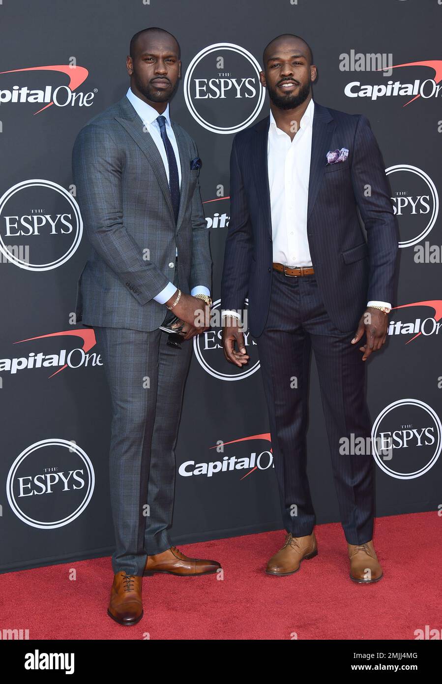 NFL player Chandler Jones, of the Arizona Cardinals, left, and UFC ...