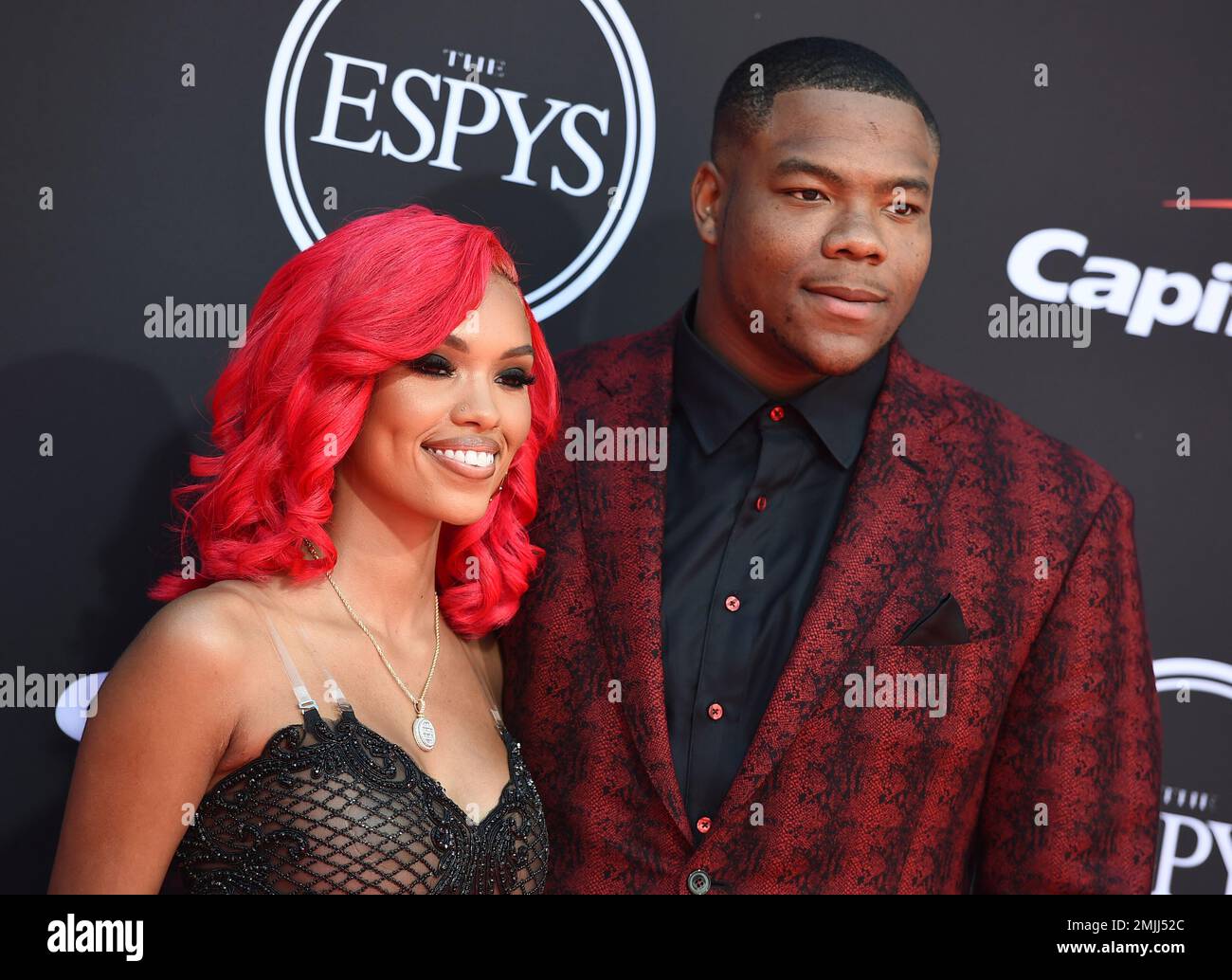 NFL player Daron Payne, of the Washington Redskins, right, and Yaunna ...