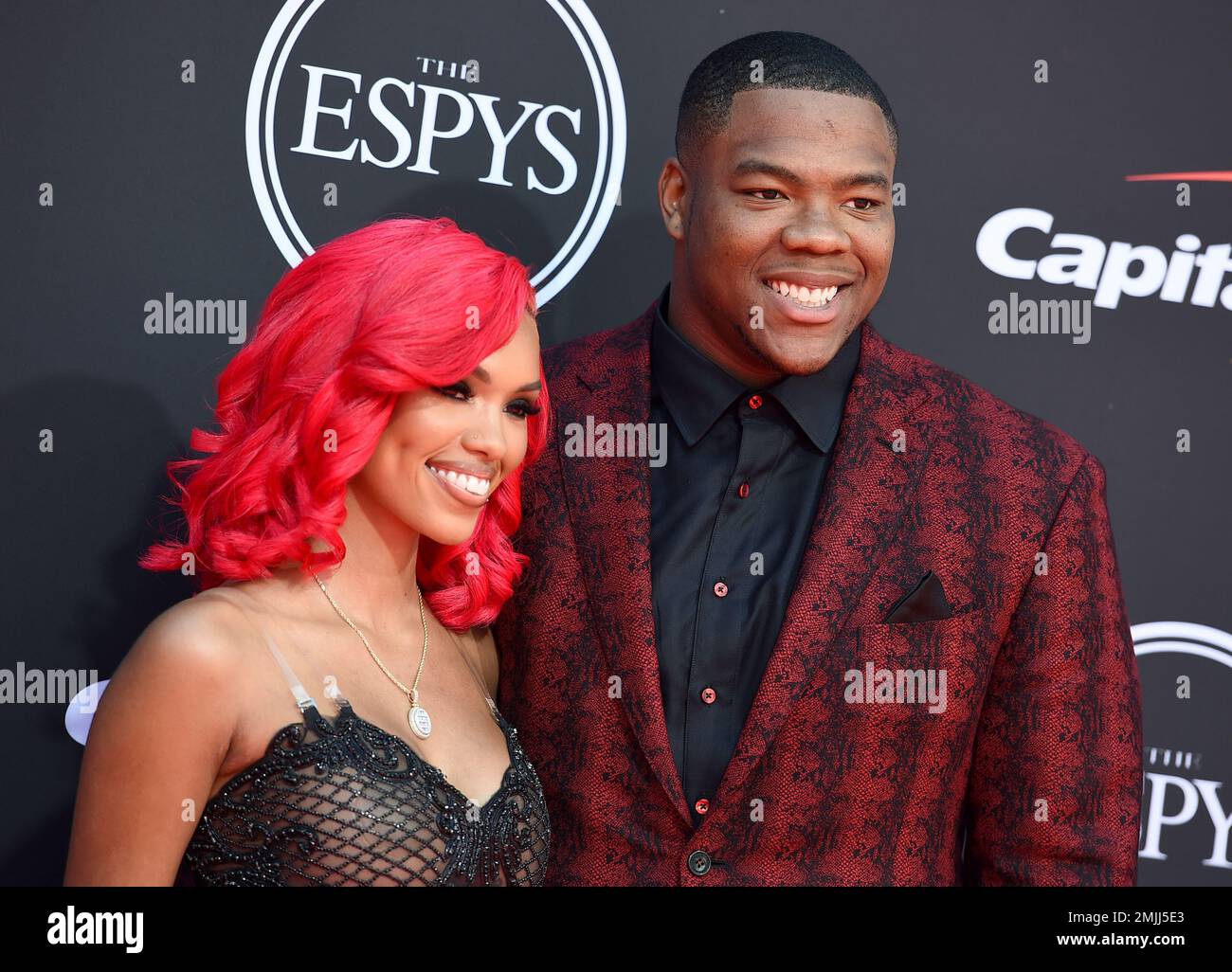 NFL player Daron Payne, of the Washington Redskins, right, and Yung ...