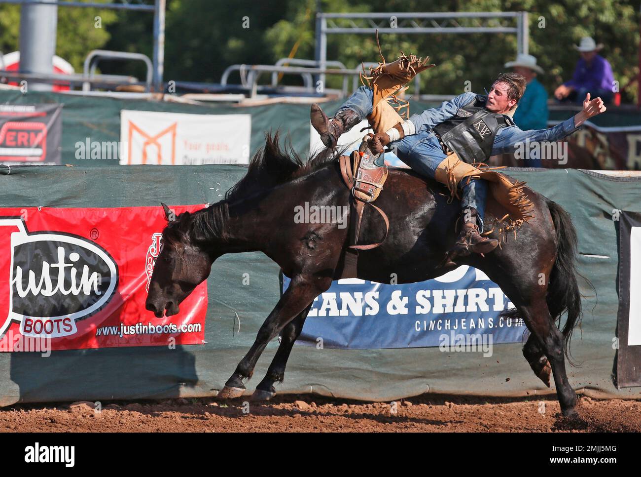 Colt Eck, of Redfield, Kansas, competes in the bareback bronc ...