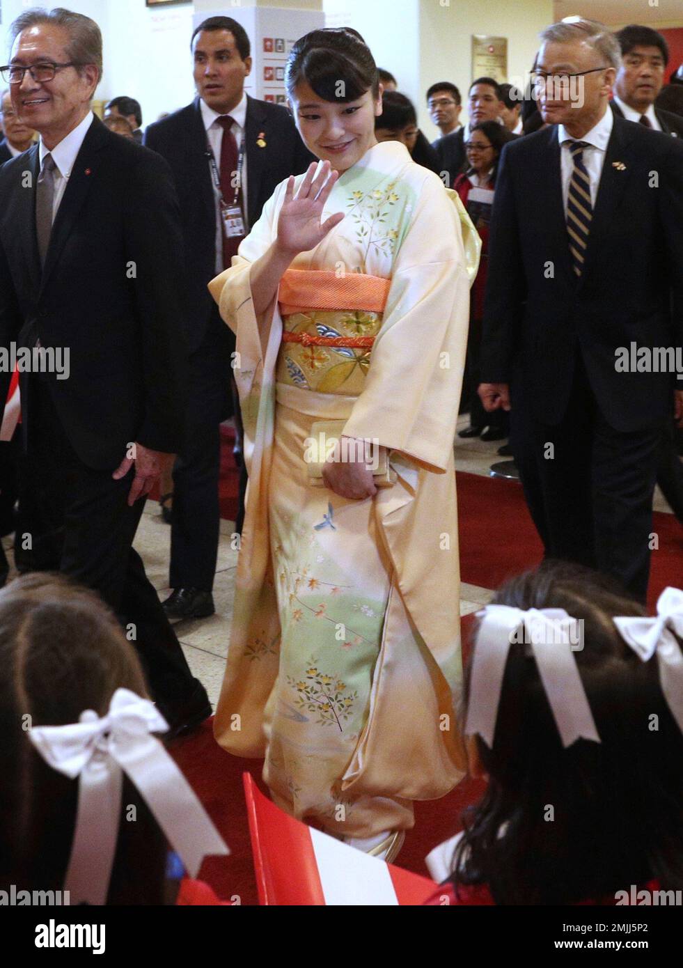 Japan's Princess Mako greets children waving Peruvian and Japanese ...